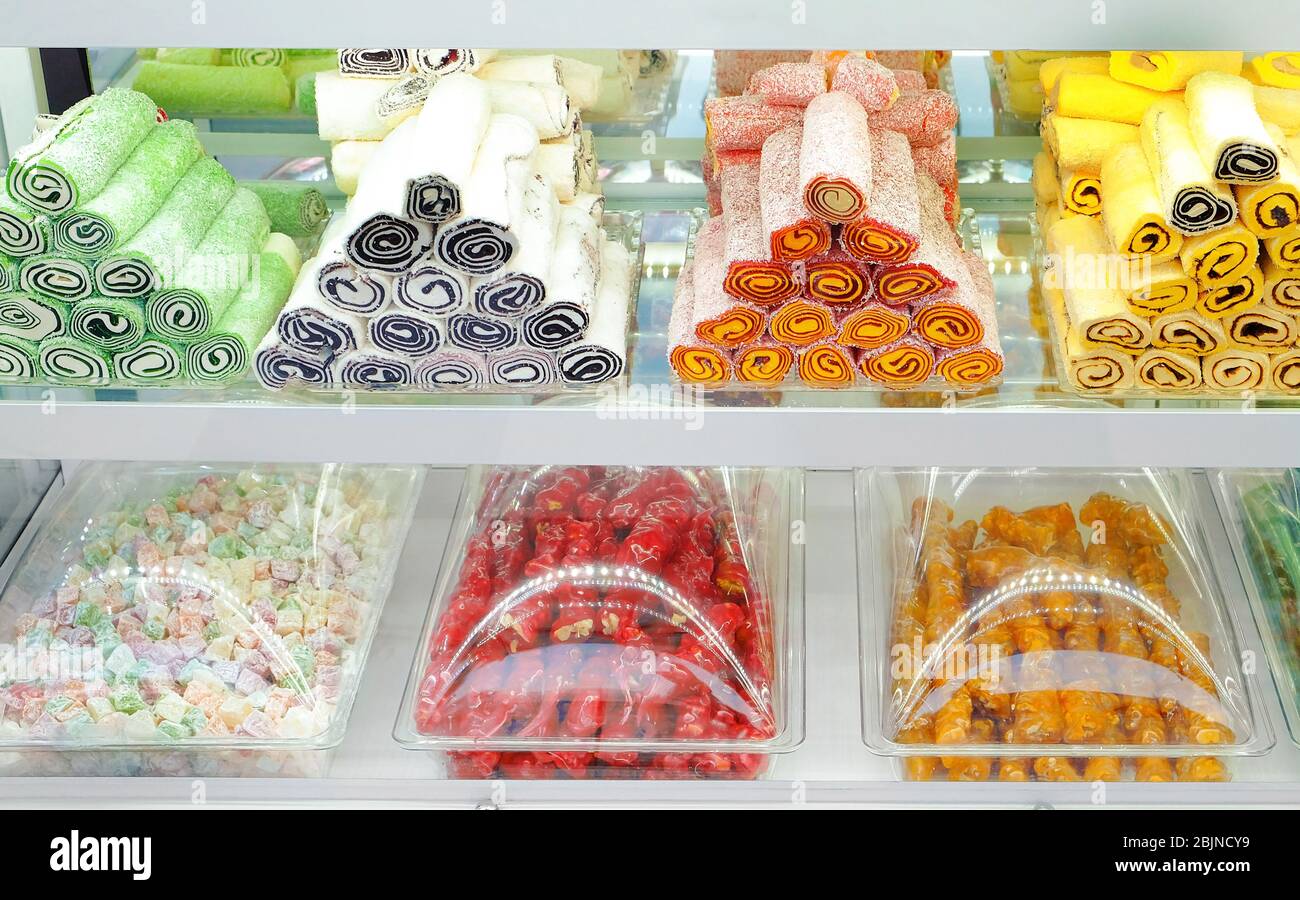 Showcase with sweets in shop Stock Photo - Alamy