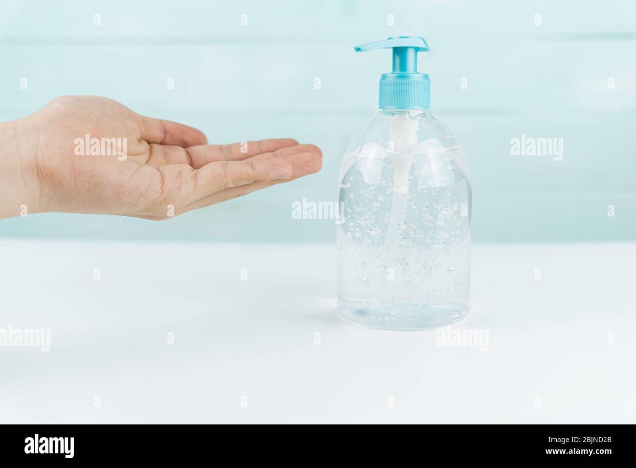 Male hand using alcohol gel clean hand hygiene for prevention ...
