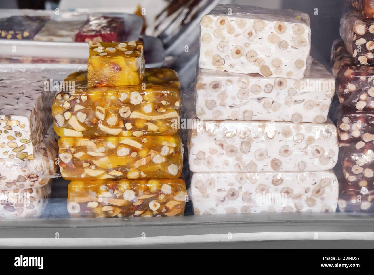 Showcase with sweets in shop Stock Photo - Alamy