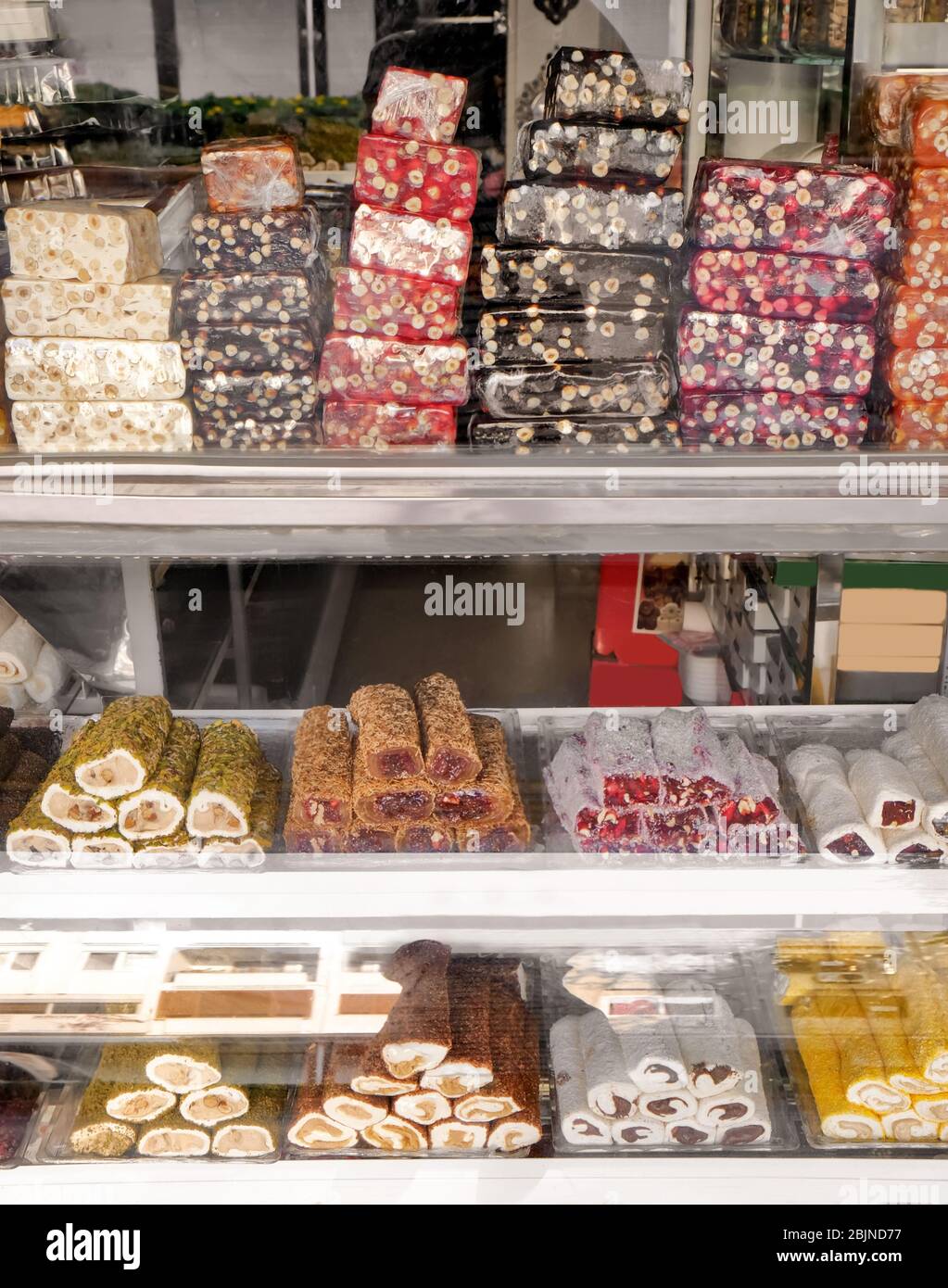 Showcase with sweets in shop Stock Photo - Alamy