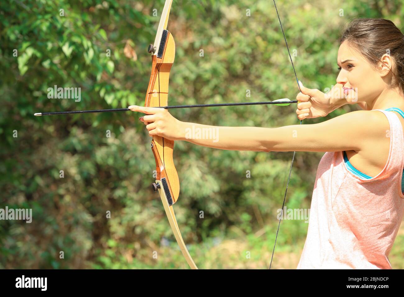 Young female archer practicing archery hi-res stock photography and ...