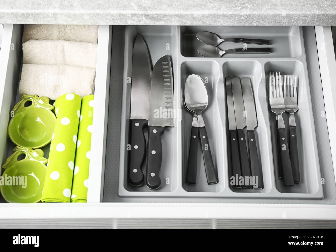 Set of cutlery in kitchen drawer Stock Photo - Alamy