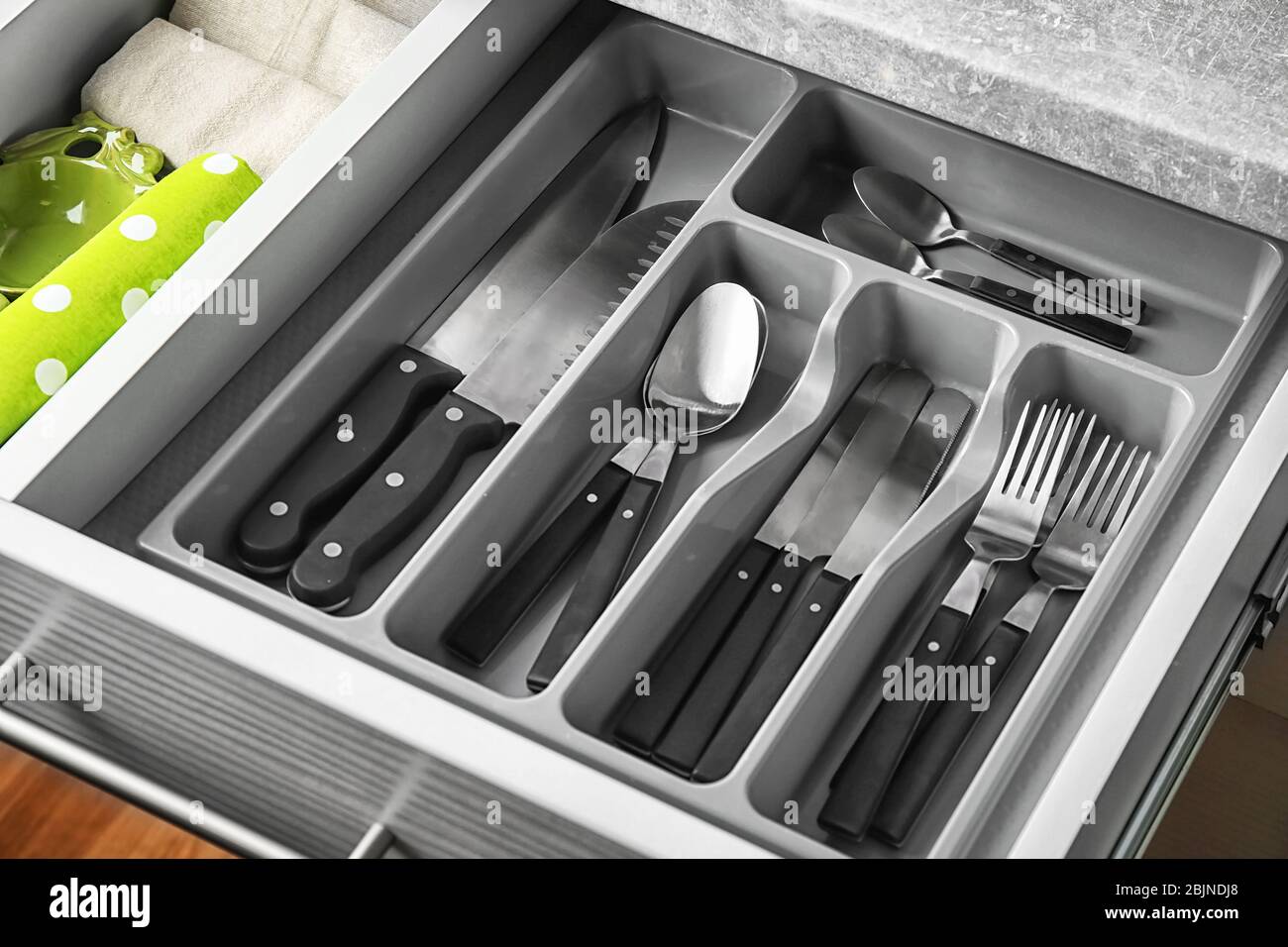 Set of cutlery in kitchen drawer Stock Photo - Alamy