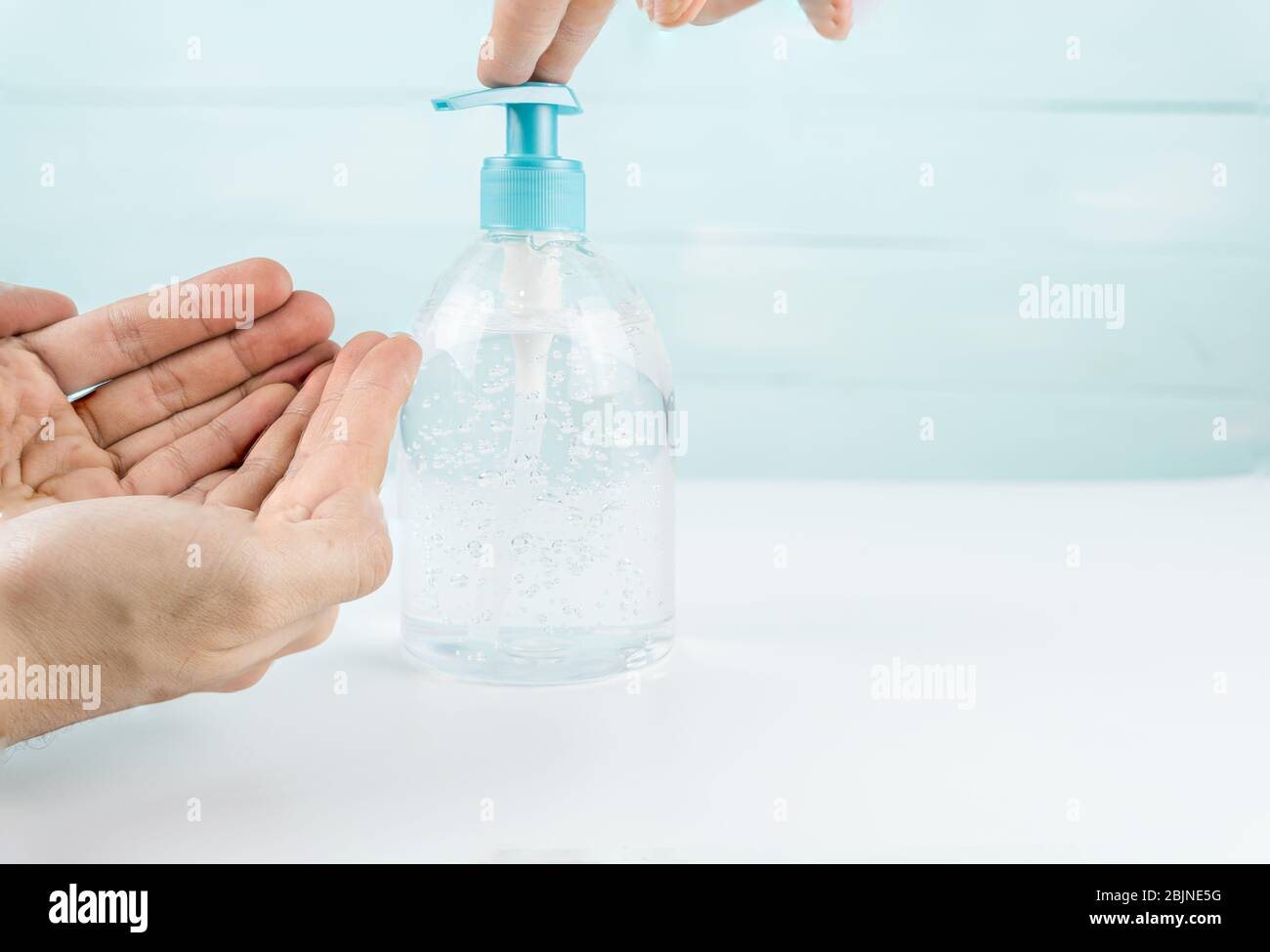 Male hand using alcohol gel clean hand hygiene for prevention ...