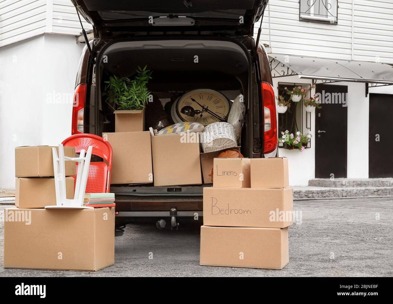 Open car trunk and moving boxes outdoors Stock Photo - Alamy