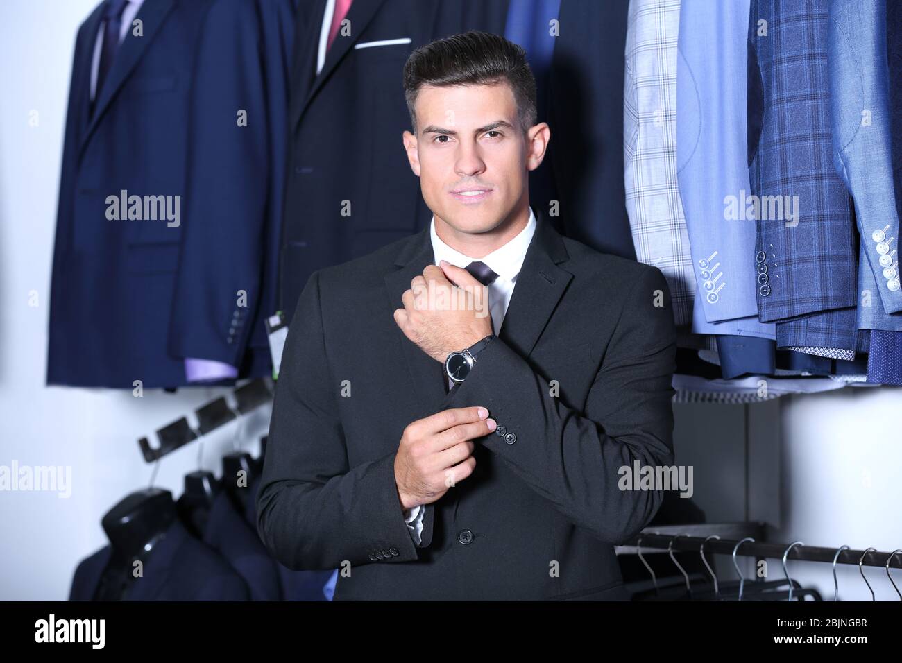 Man in shop wearing suit hi-res stock photography and images - Alamy