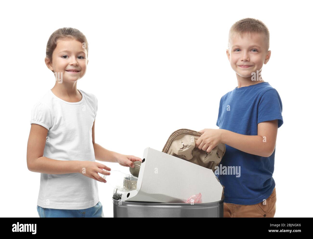 Little children throwing garbage into litter bin on white background ...