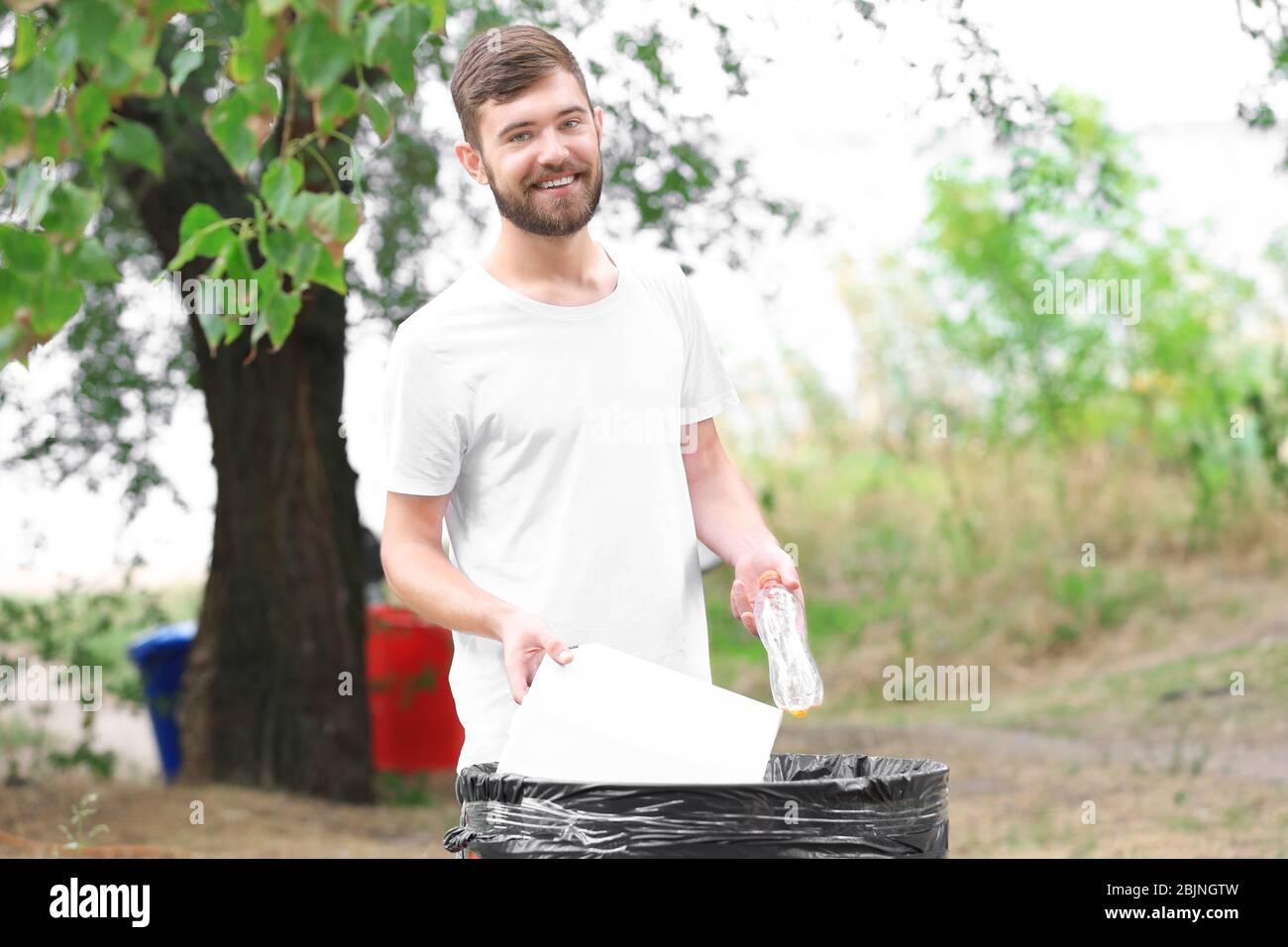 Man throwing garbage hi-res stock photography and images - Alamy