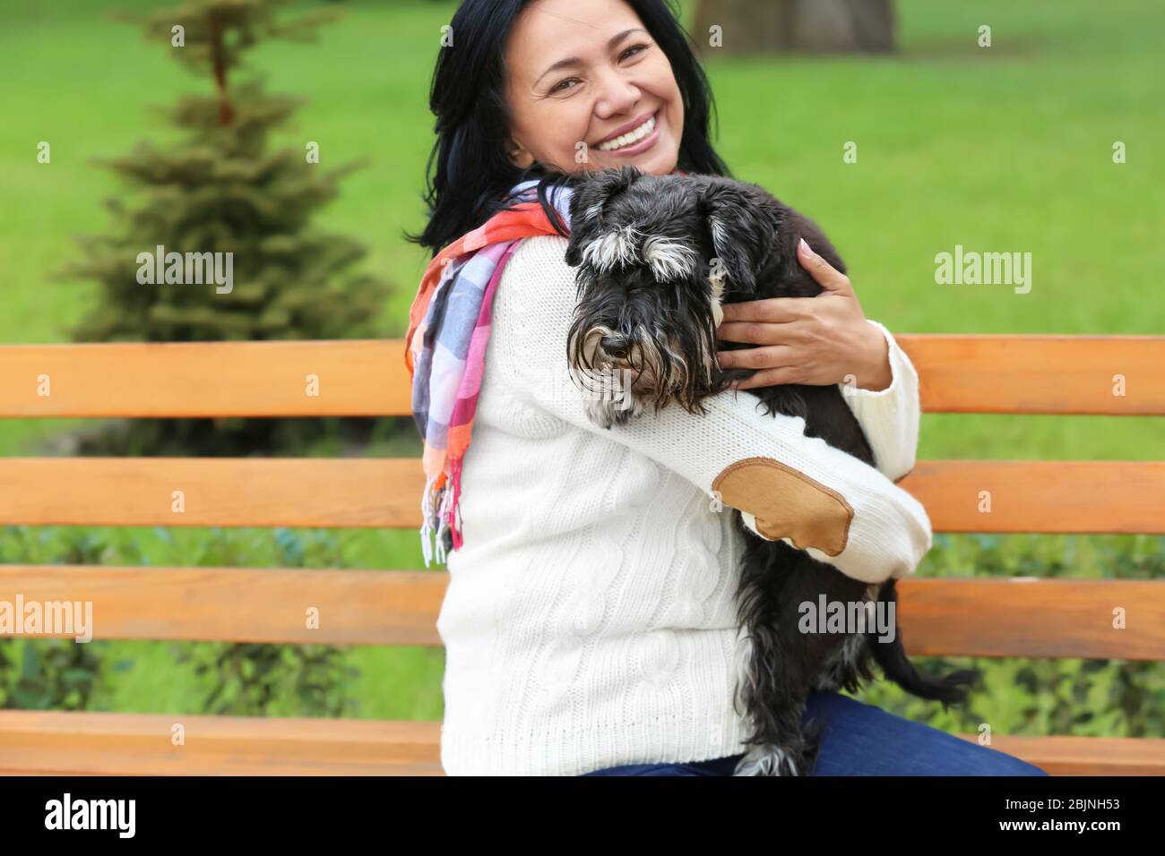 Asian lady holding dog hi-res stock photography and images - Alamy