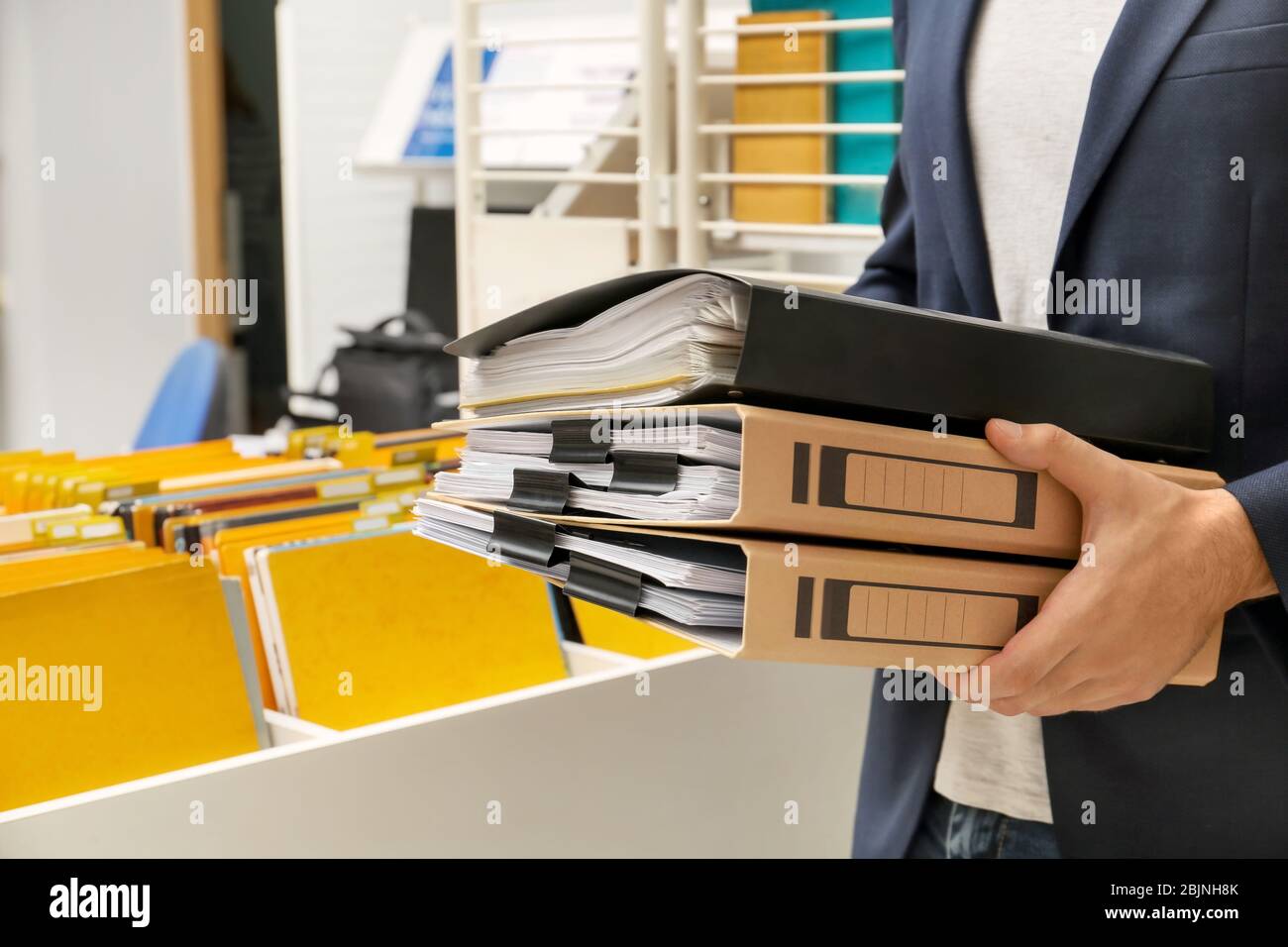 Man searching for documents in archive Stock Photo - Alamy
