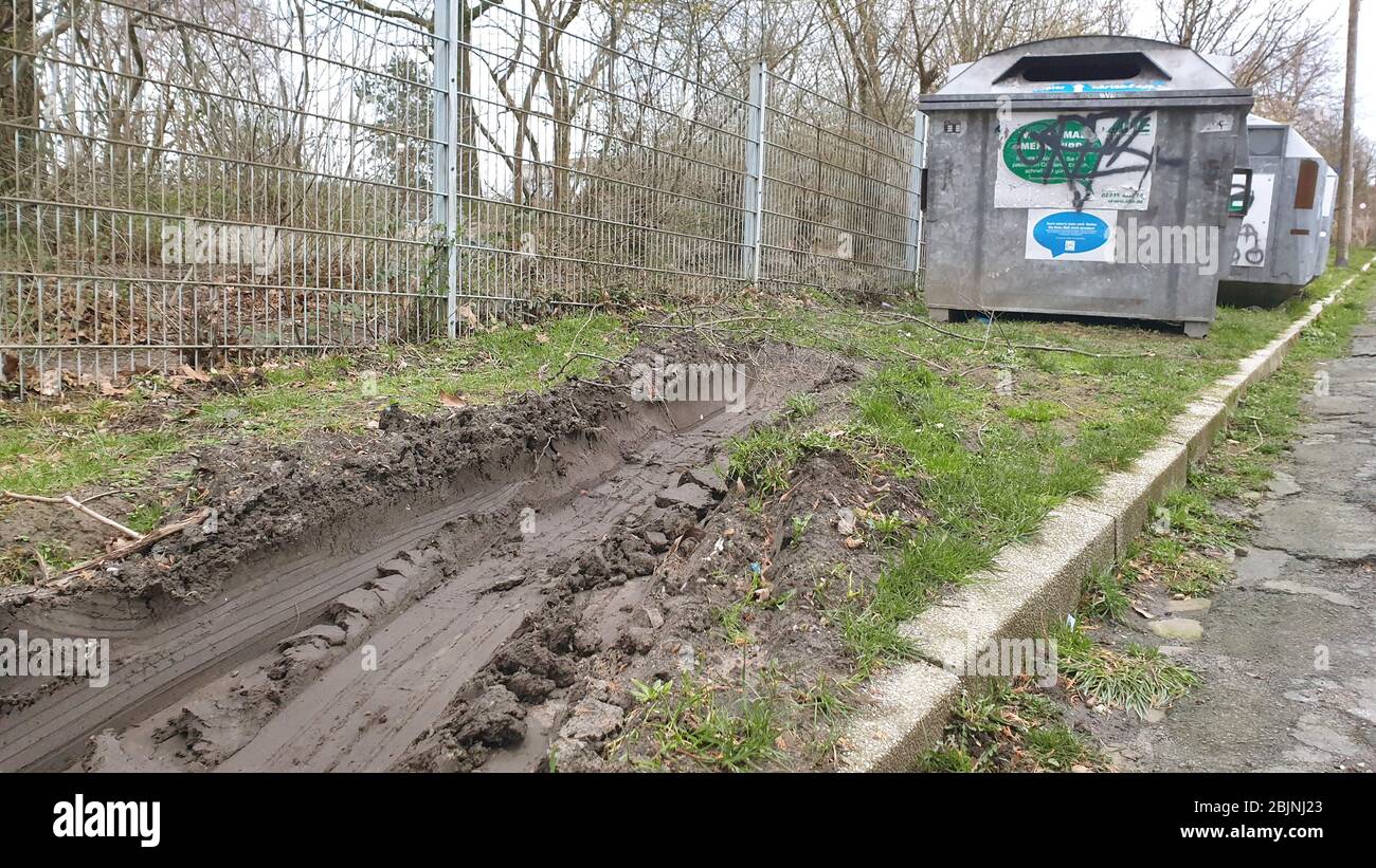 truck leaves deep tracks in a lawn, Germany Stock Photo - Alamy