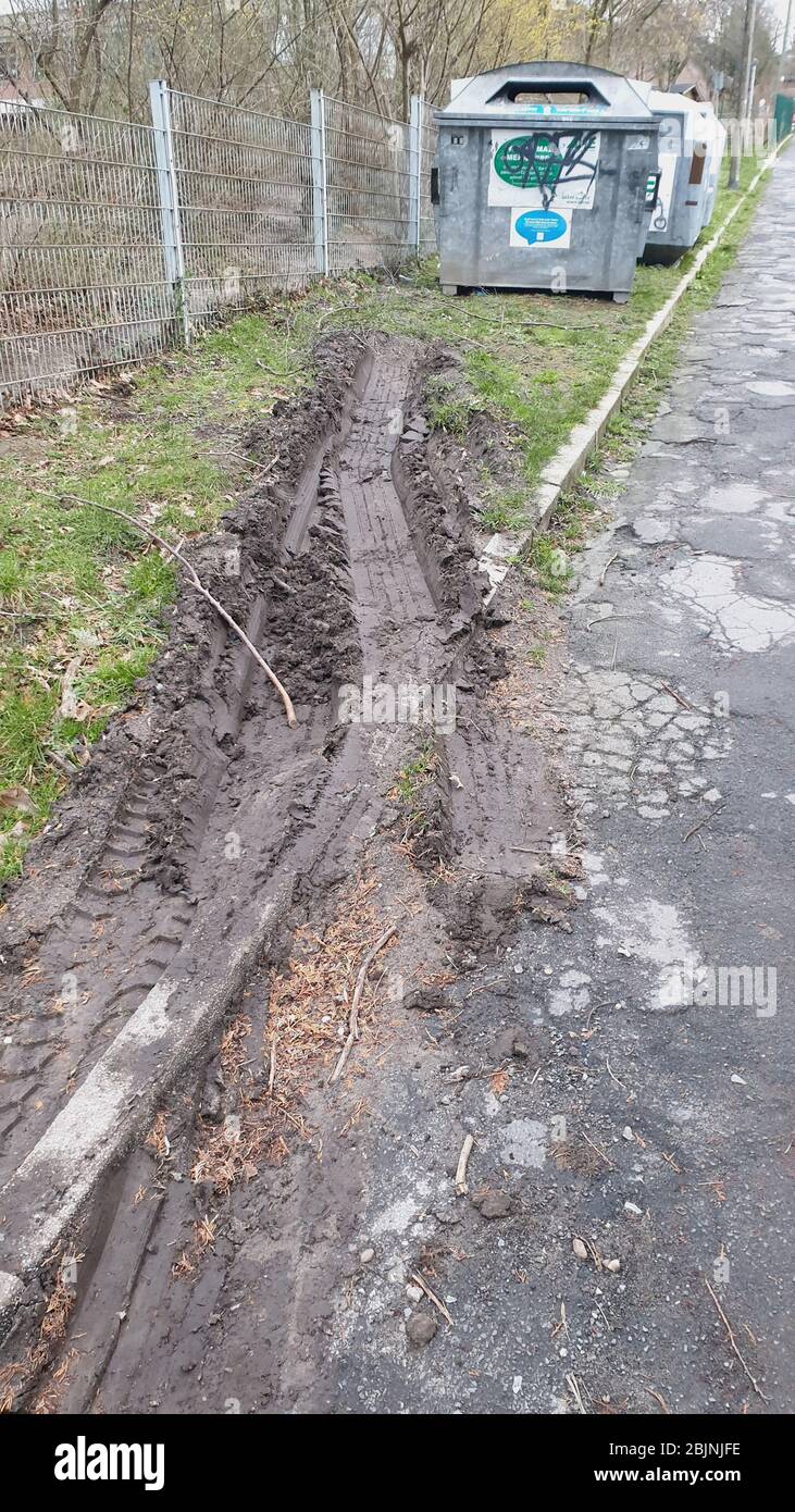 truck leaves deep tracks in a lawn, Germany Stock Photo - Alamy