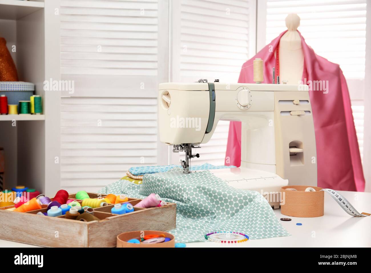 Tailor's workplace with modern sewing machine Stock Photo - Alamy