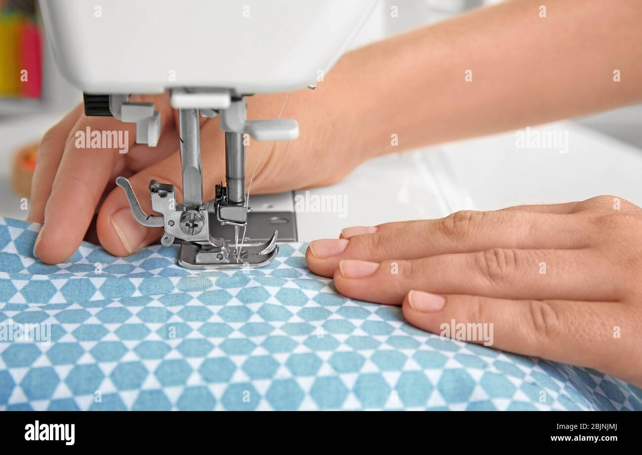 Closeup woman sewing modern machine hi-res stock photography and images ...