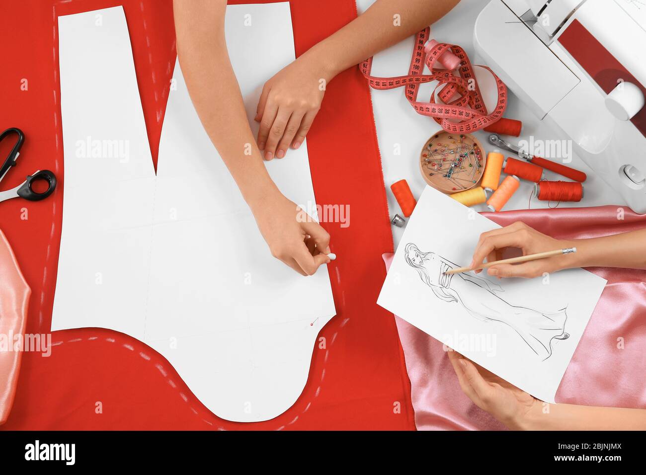 Two female tailors at work Stock Photo - Alamy