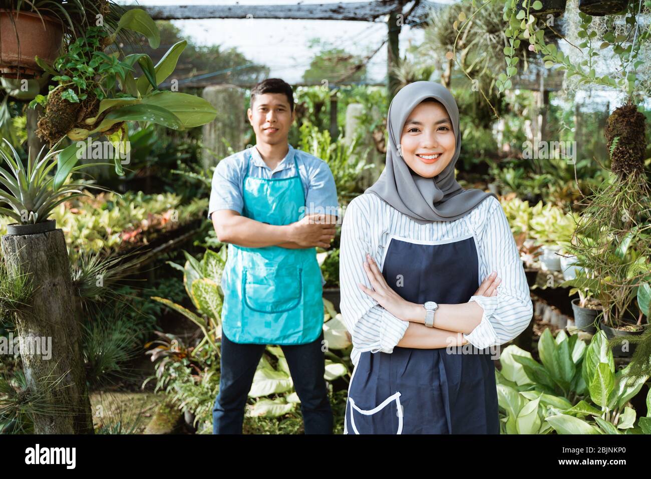 happy gardener team working in the garden. botanical concept Stock ...
