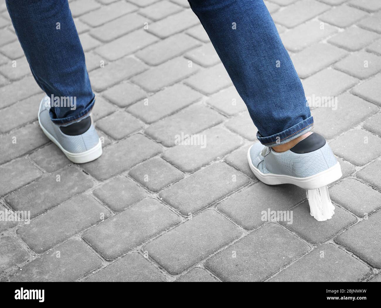 Foot stuck into chewing gum on street. Concept of stickiness Stock ...