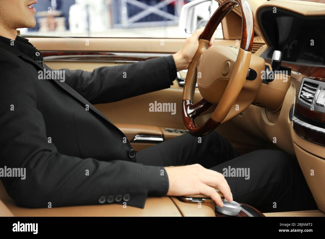 Young man on driver seat of car Stock Photo - Alamy