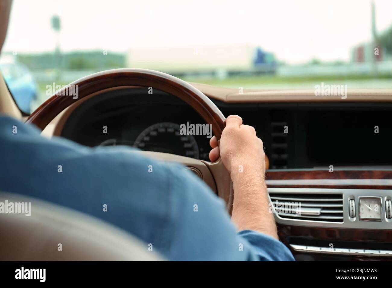 Holding hand on steering wheel hi-res stock photography and images - Alamy