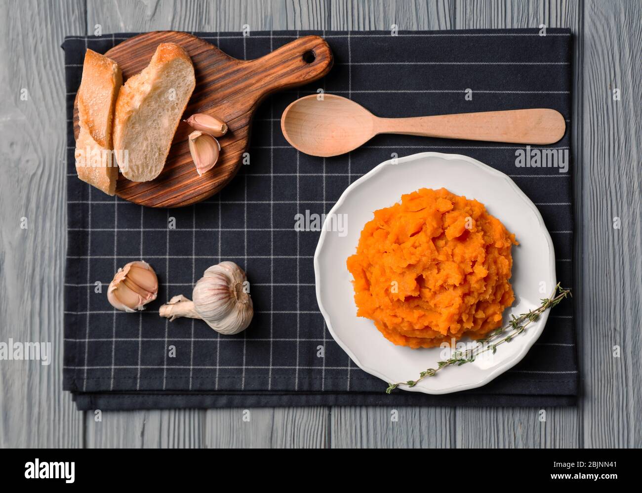 Composition with mashed sweet potato on wooden background Stock Photo ...