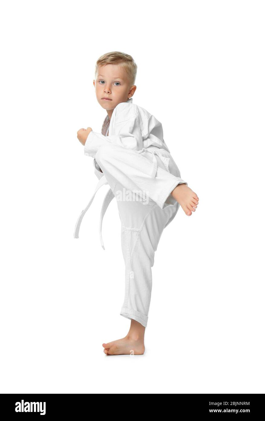 Little boy practicing karate on white background Stock Photo - Alamy