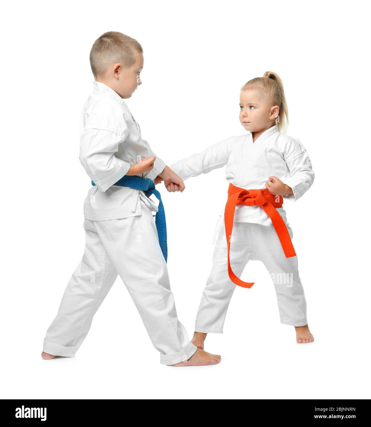 Little children practicing karate on white background Stock Photo - Alamy