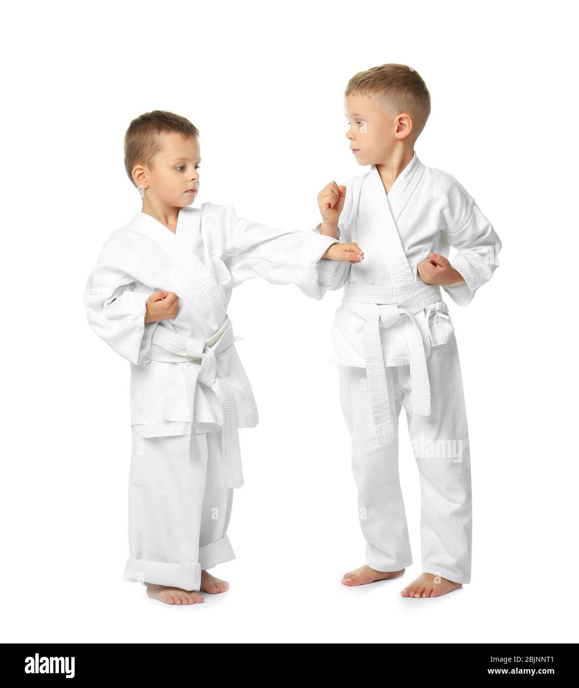 Little children practicing karate on white background Stock Photo - Alamy