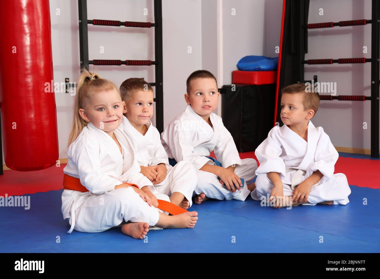 Little children wearing karategi in dojo Stock Photo - Alamy
