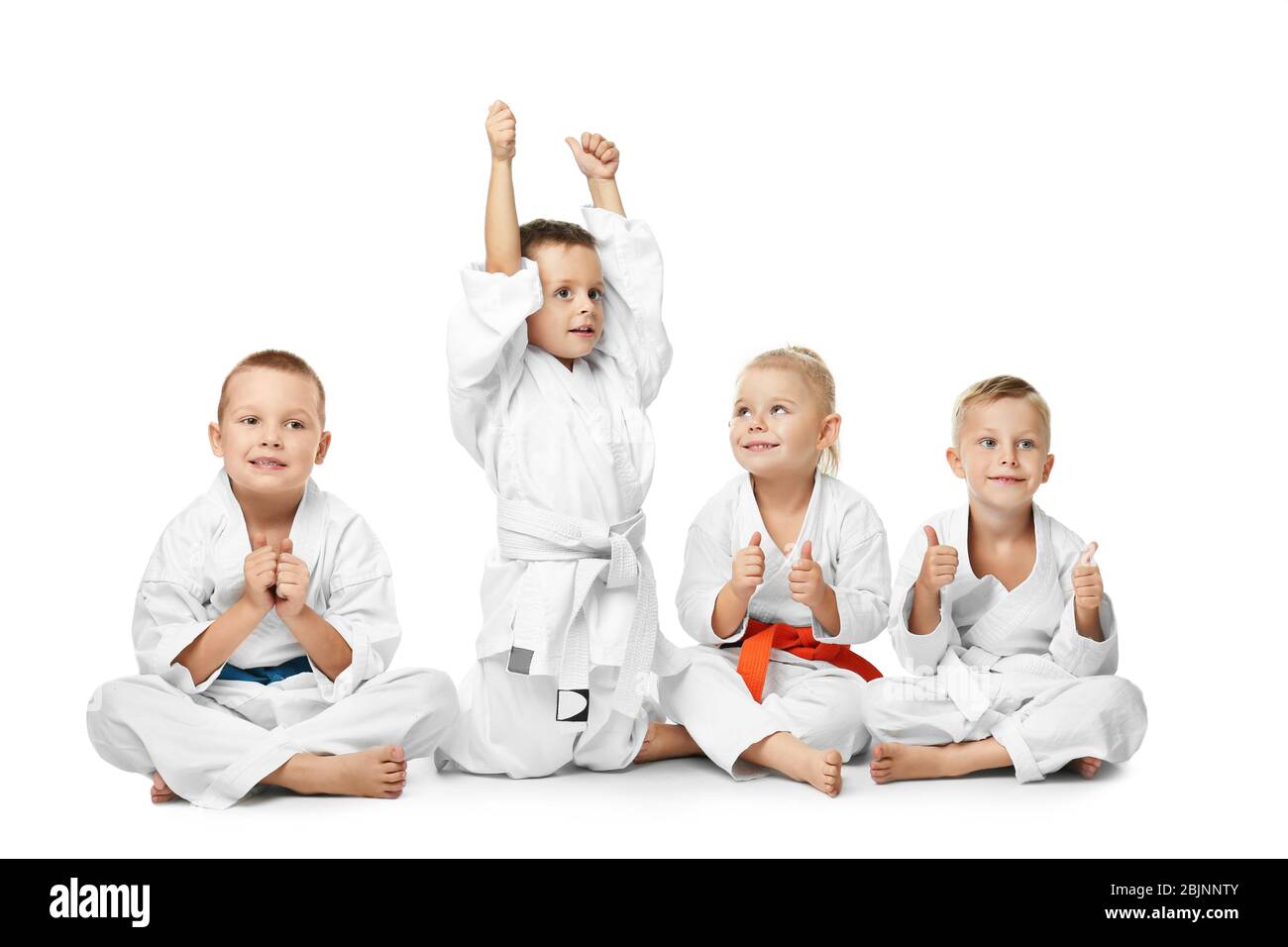 Little children in karategi on white background Stock Photo - Alamy