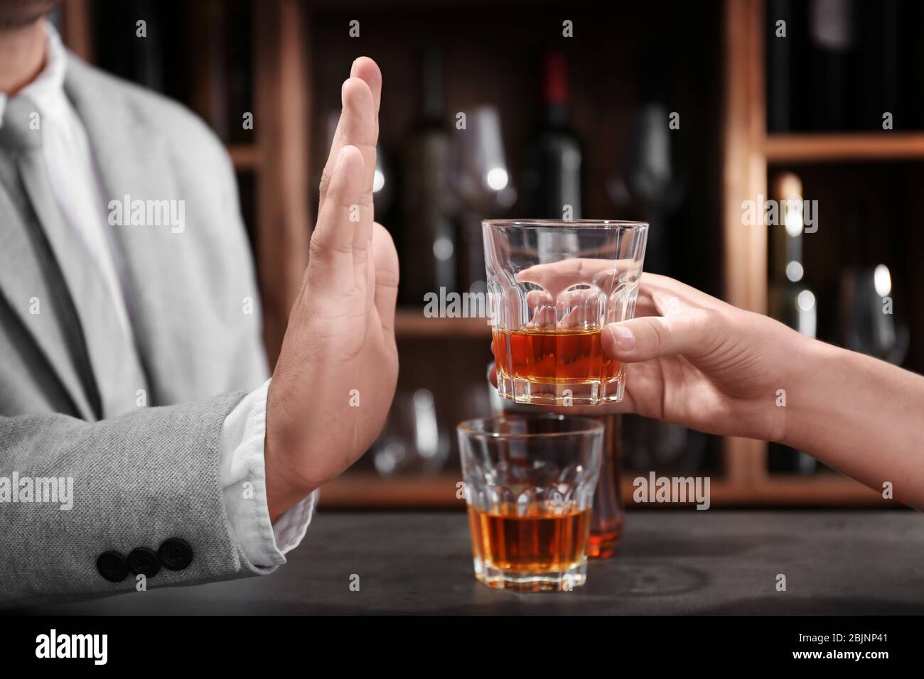Man rejecting glass of alcohol in bar. Healthy lifestyle concept Stock ...