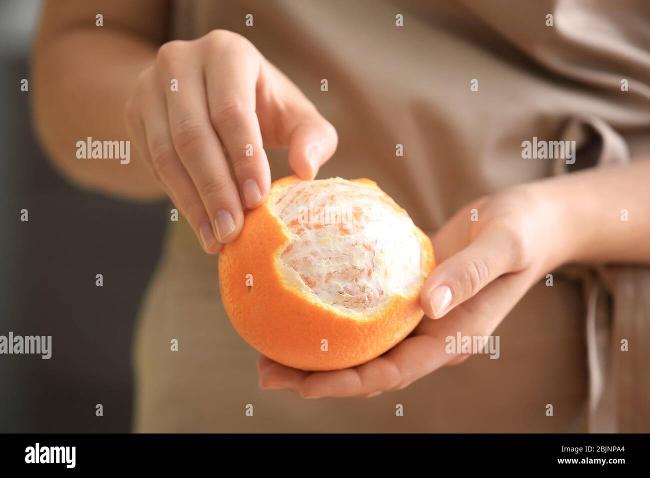 Closeup hands peeling orange fruit hi-res stock photography and images ...