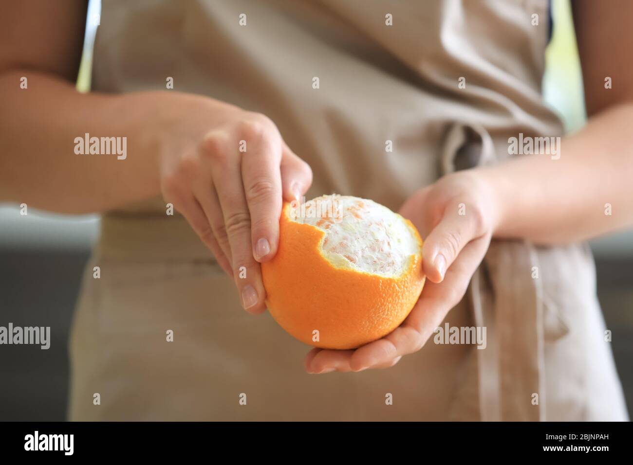 Closeup hands peeling orange fruit hi-res stock photography and images ...