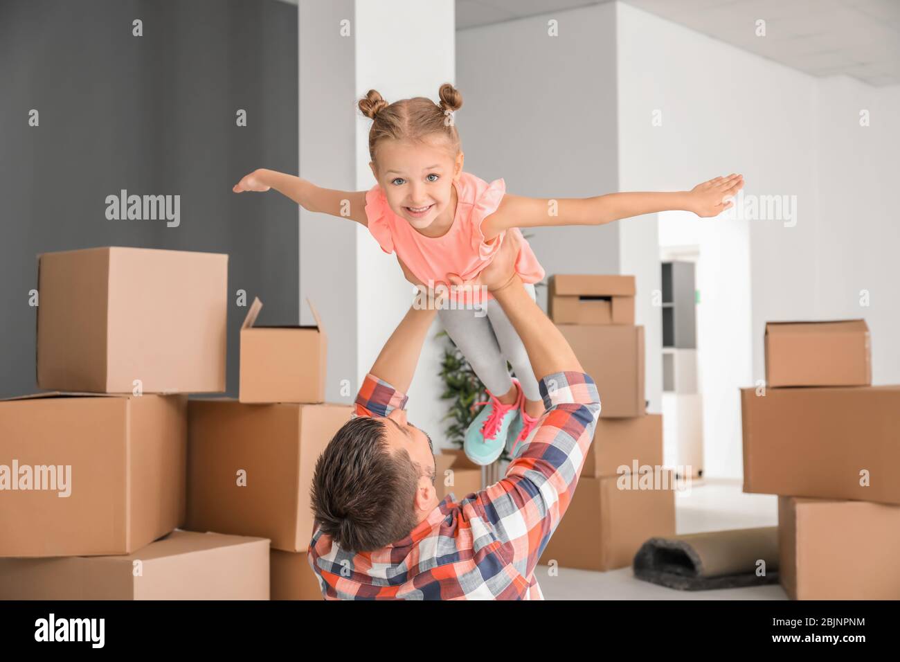 Happy father with child in new flat Stock Photo - Alamy