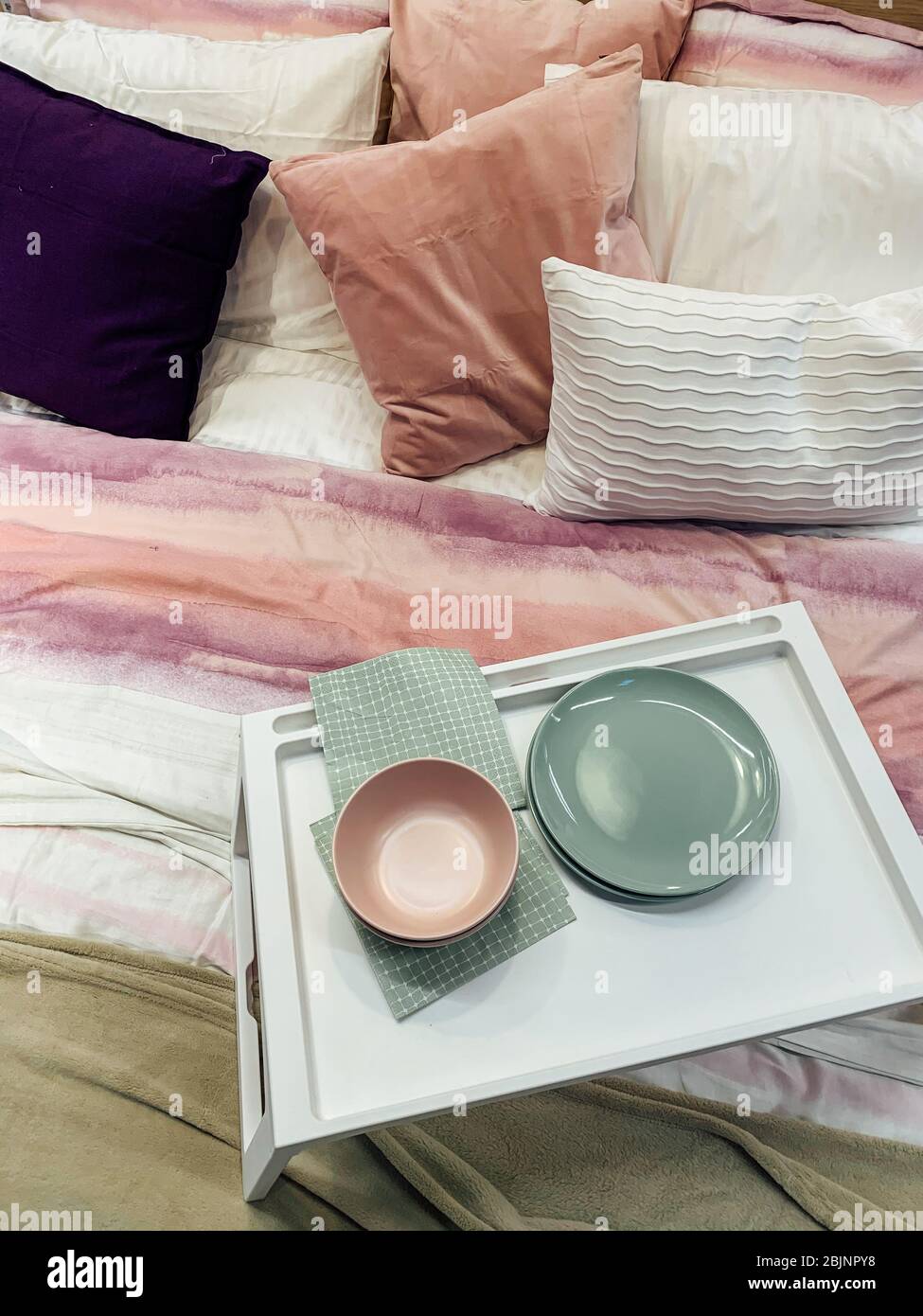 bed in the bedroom without people as background Stock Photo - Alamy
