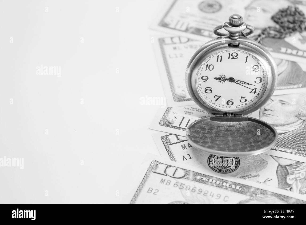 Classic pocket watch on dollar banknote, concept and idea of time value ...
