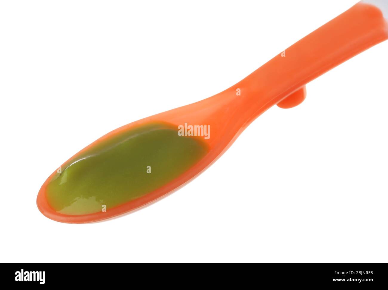 Plastic spoon with baby food on white background Stock Photo - Alamy