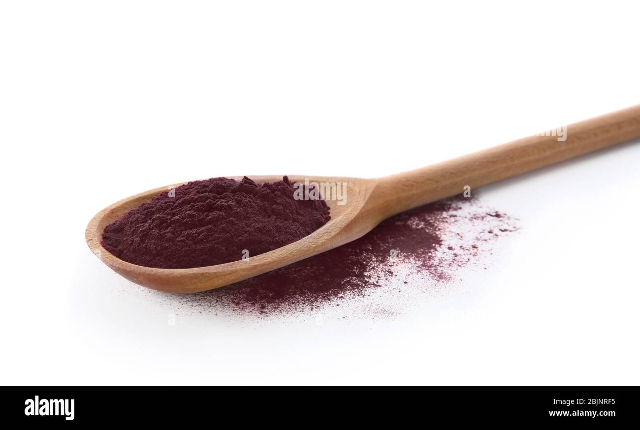 Wooden spoon and acai powder on white background Stock Photo - Alamy