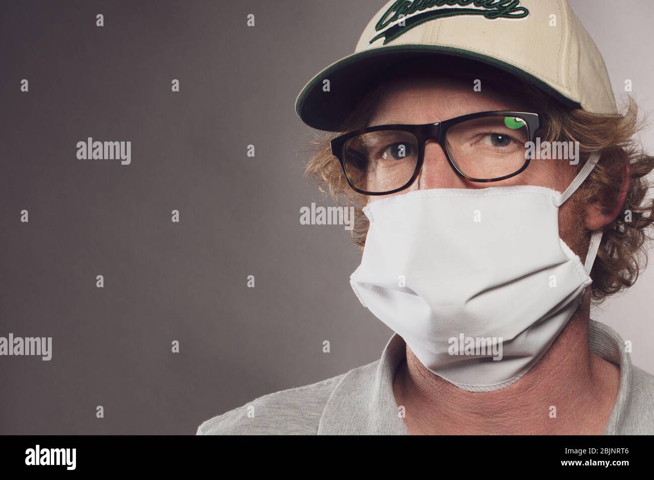 Man with face mask protecting himself and others Stock Photo - Alamy
