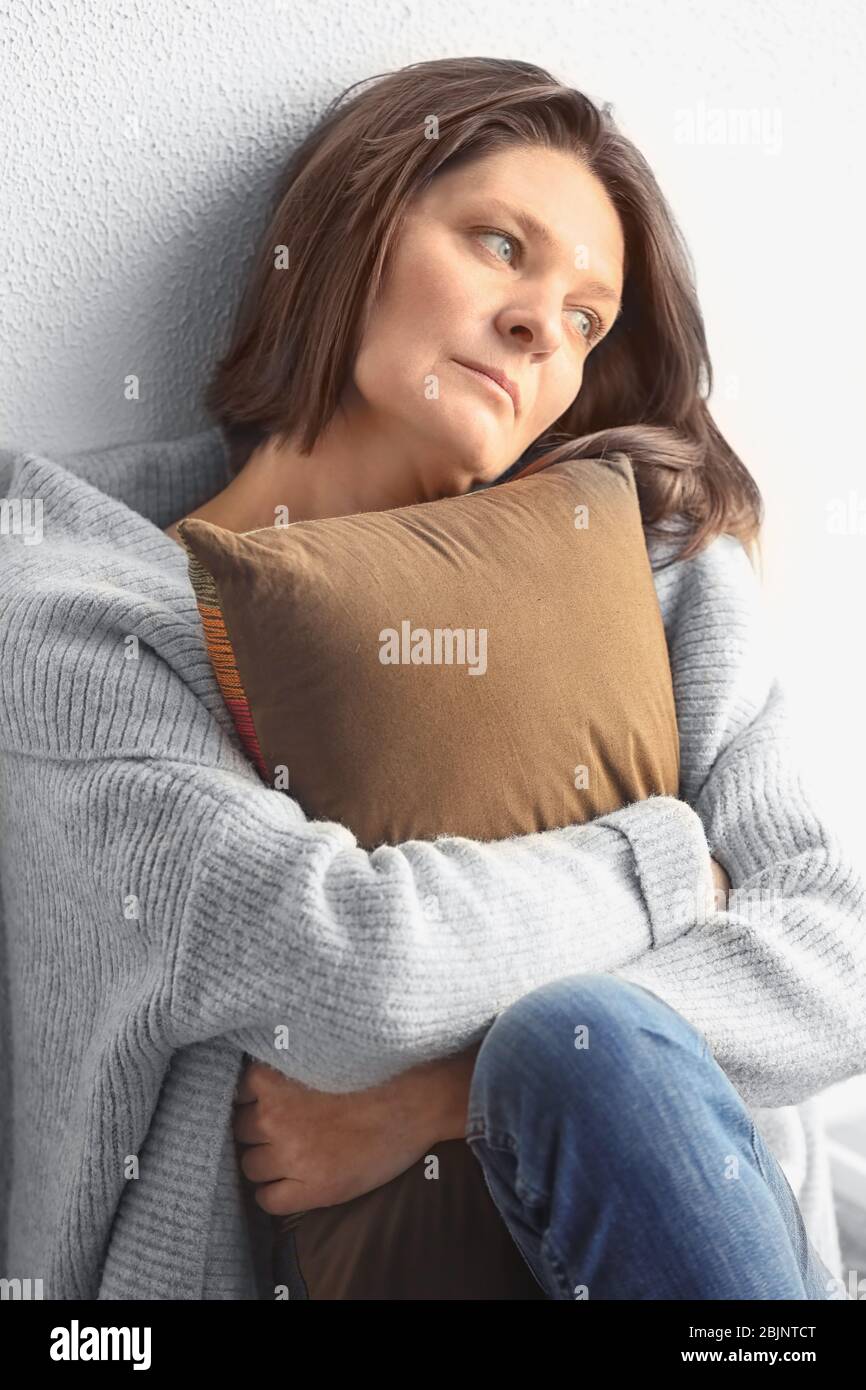 Beautiful depressed woman at home Stock Photo - Alamy
