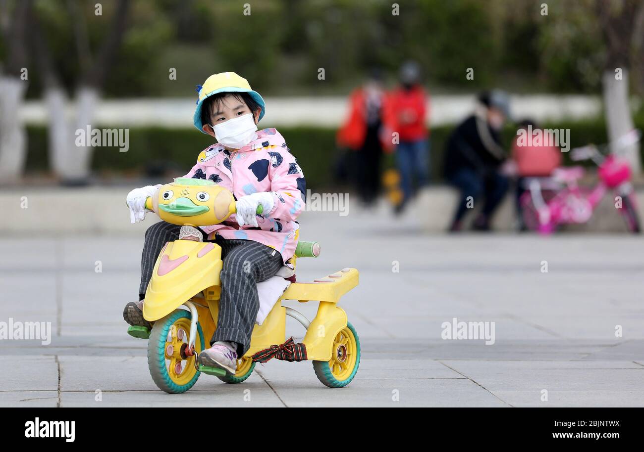 Benxi, China's Liaoning Province. 29th Apr, 2020. A girl rides a ...