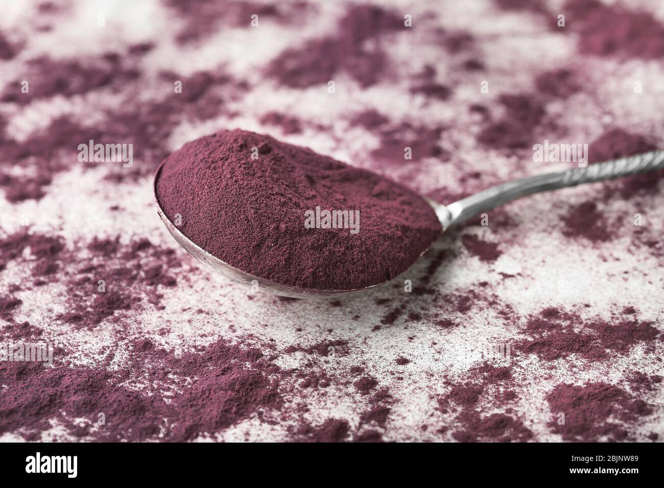 Spoon with acai powder on table Stock Photo - Alamy