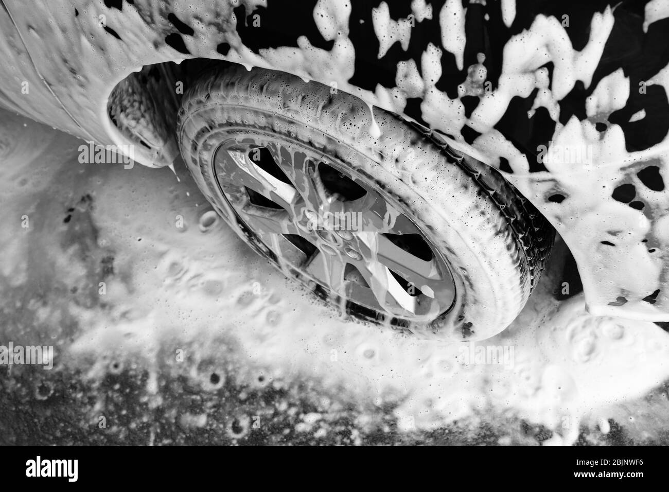 Automobile in suds at car wash, closeup Stock Photo - Alamy