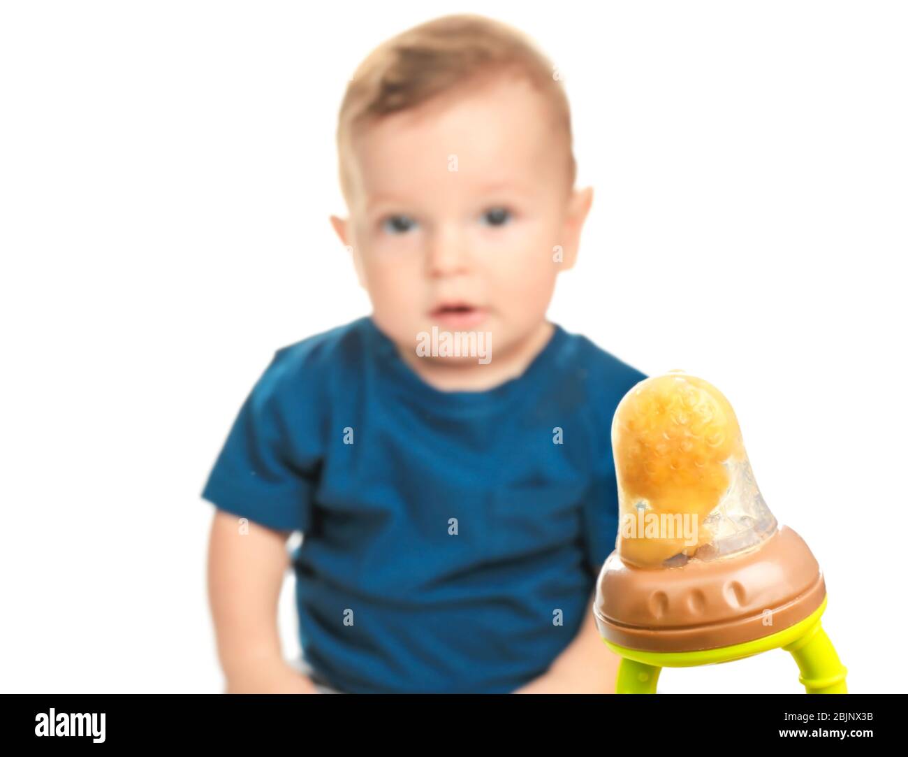 Plastic nibbler and little baby on white background Stock Photo - Alamy