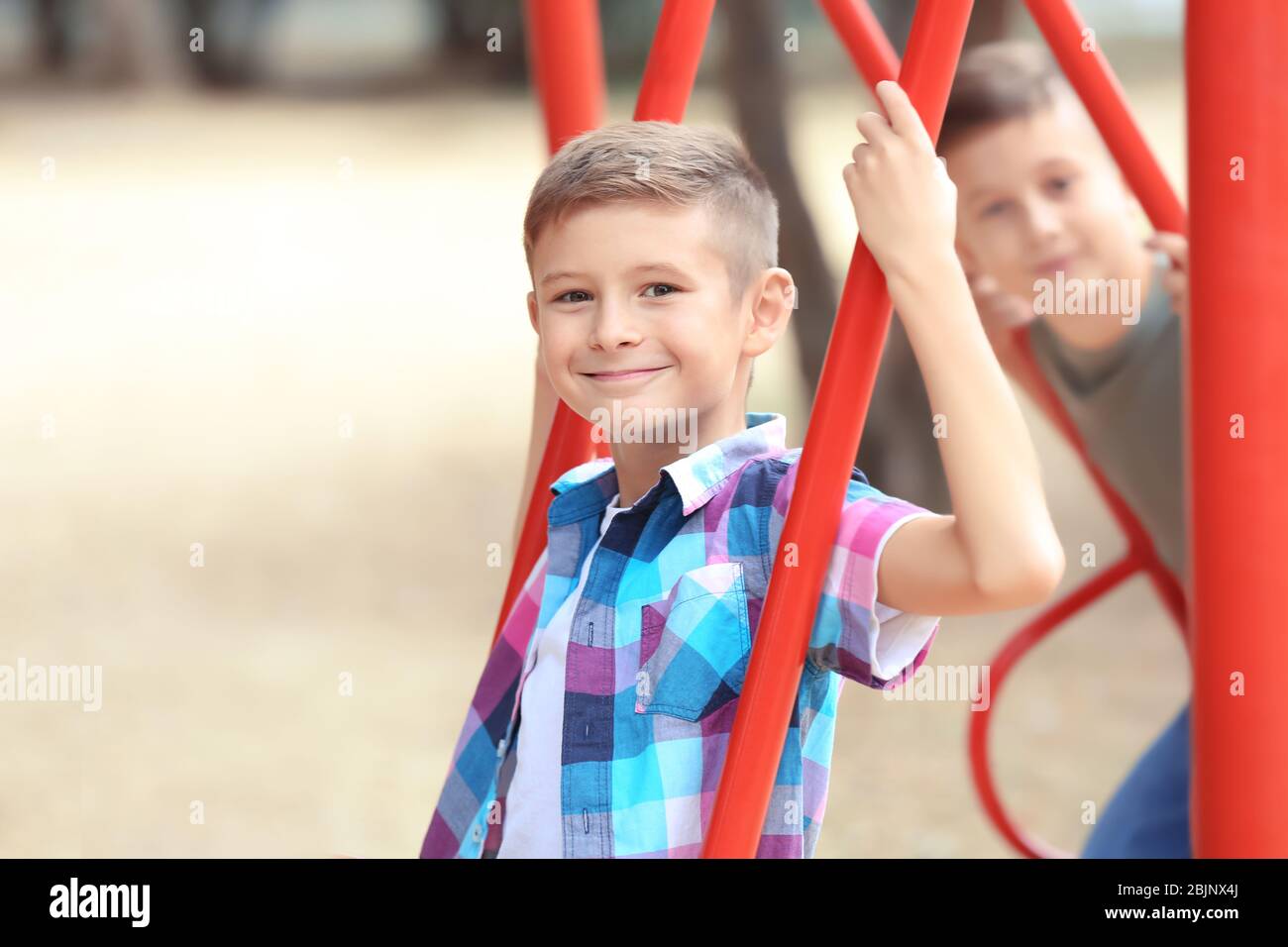 Cute boy on playground Stock Photo - Alamy