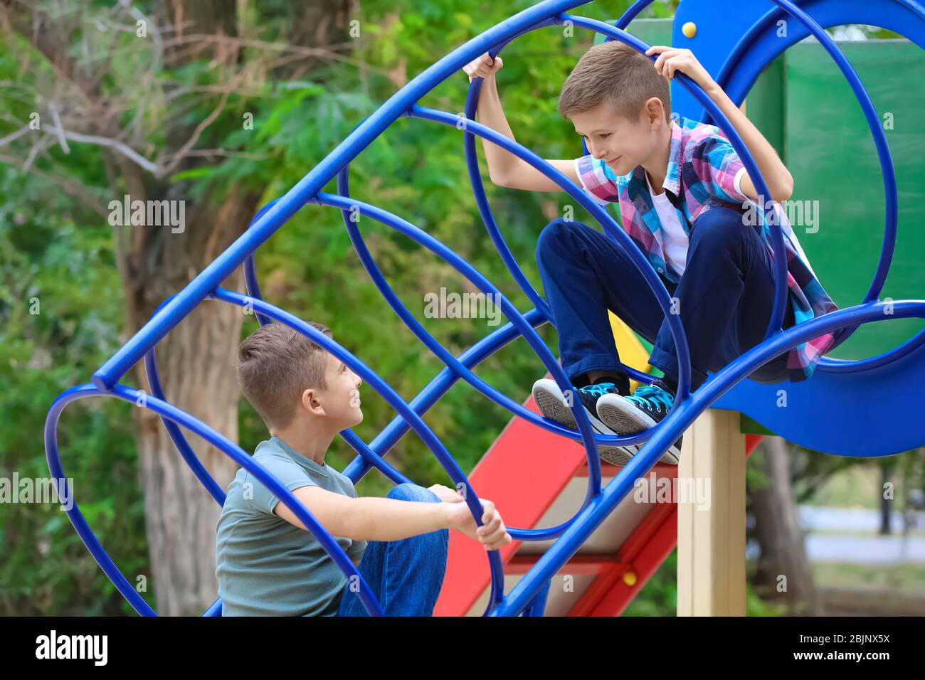 Cute boys on playground Stock Photo - Alamy
