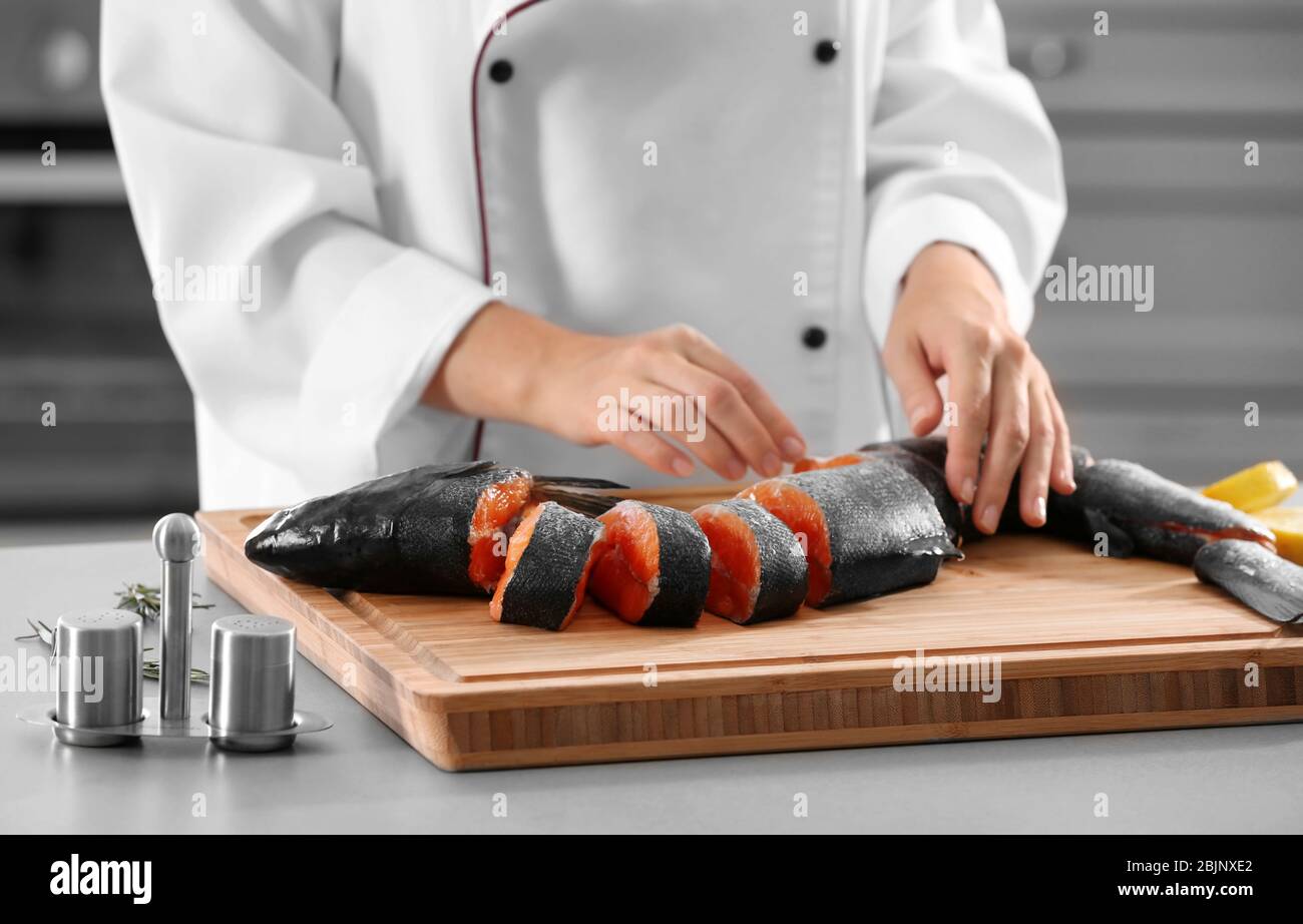 Woman cut salmon steak hi-res stock photography and images - Alamy