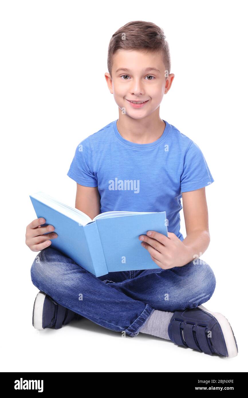 Cute little boy reading book on white background Stock Photo - Alamy