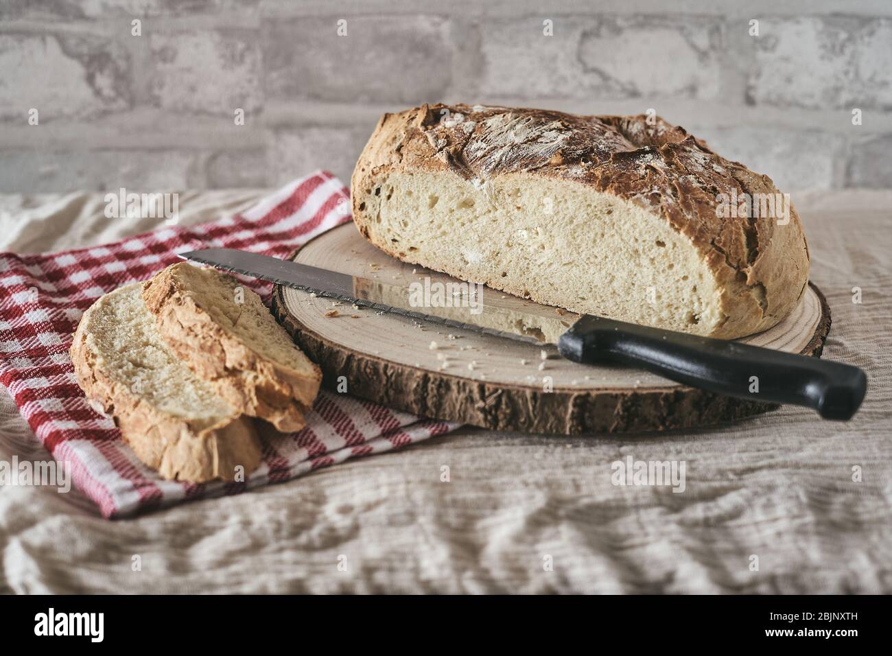 Baked and sliced homemade traditional village bread Stock Photo - Alamy