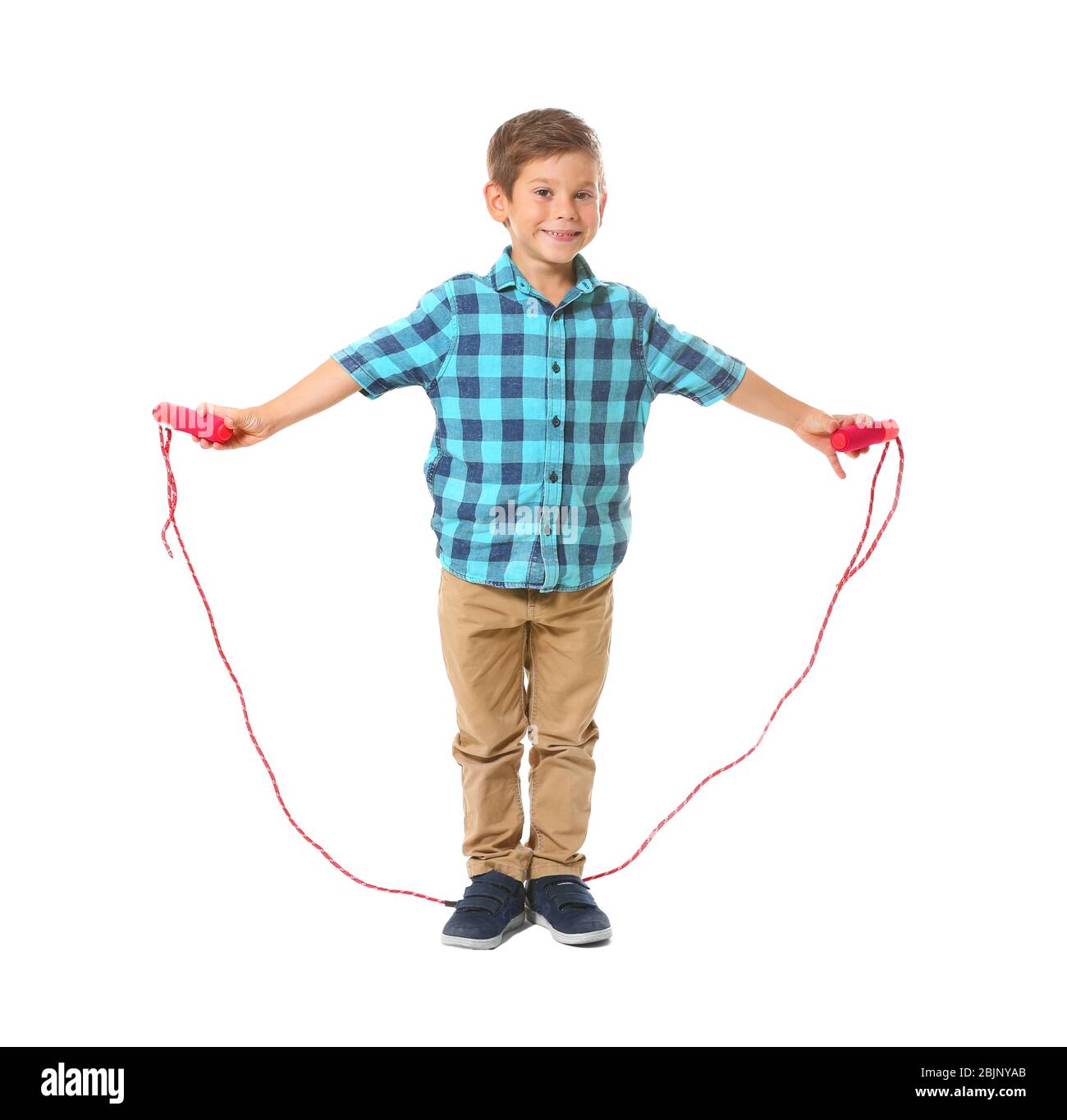 Adorable boy skipping rope, isolated on white Stock Photo - Alamy