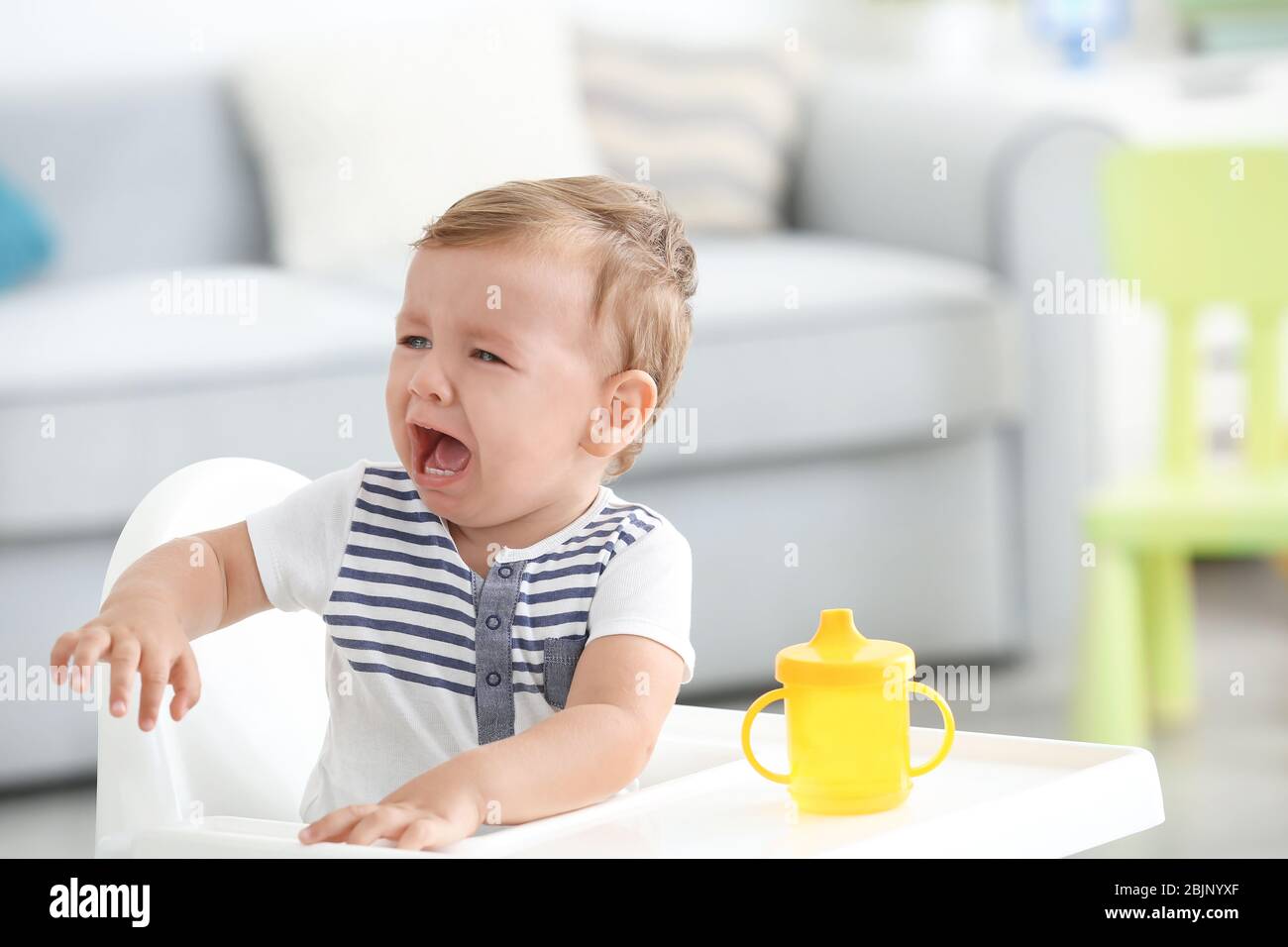 Baby highchair crying hi-res stock photography and images - Alamy